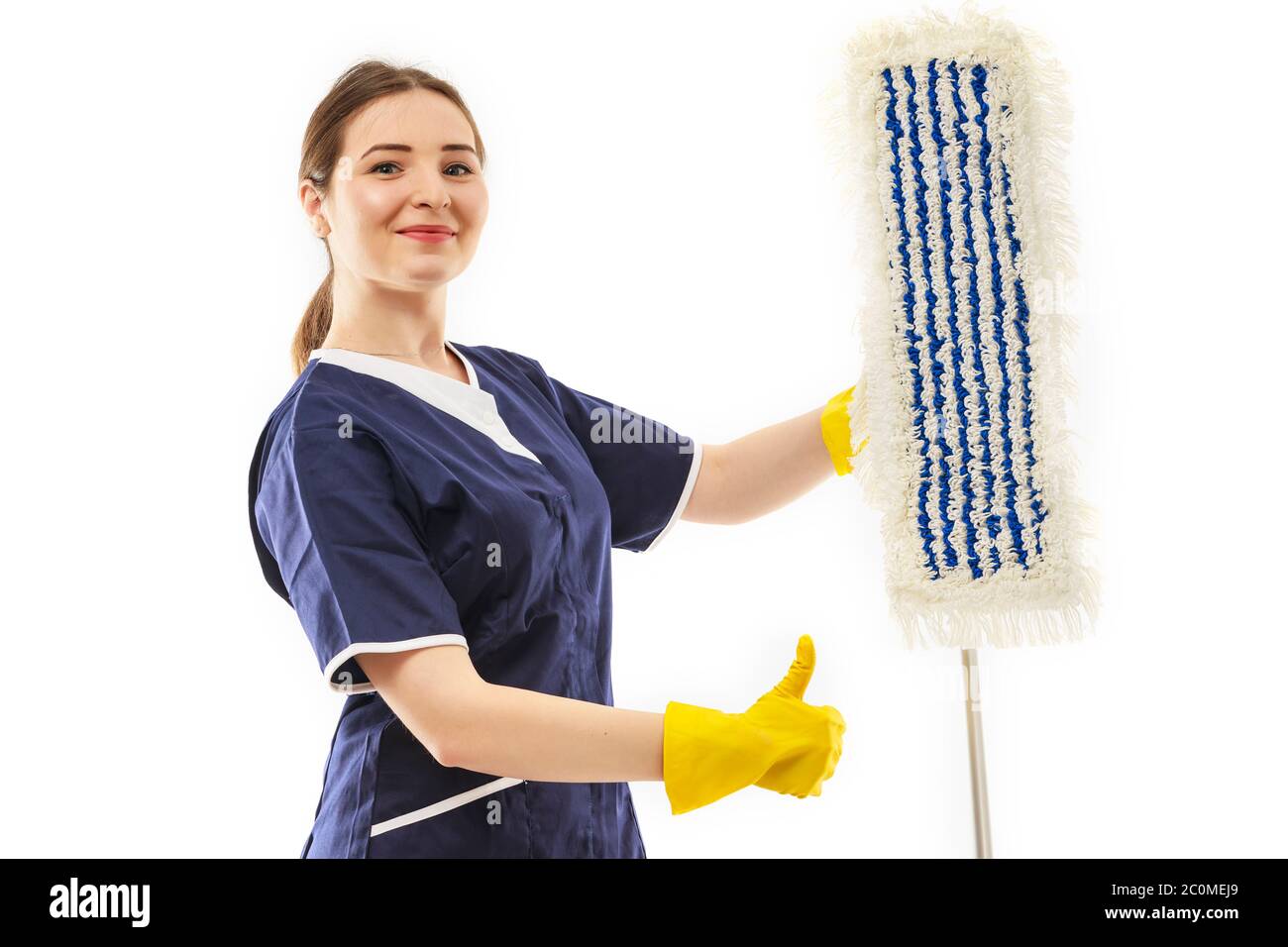 Woman finished cleaning showing a happy thumbs up after a successful ...