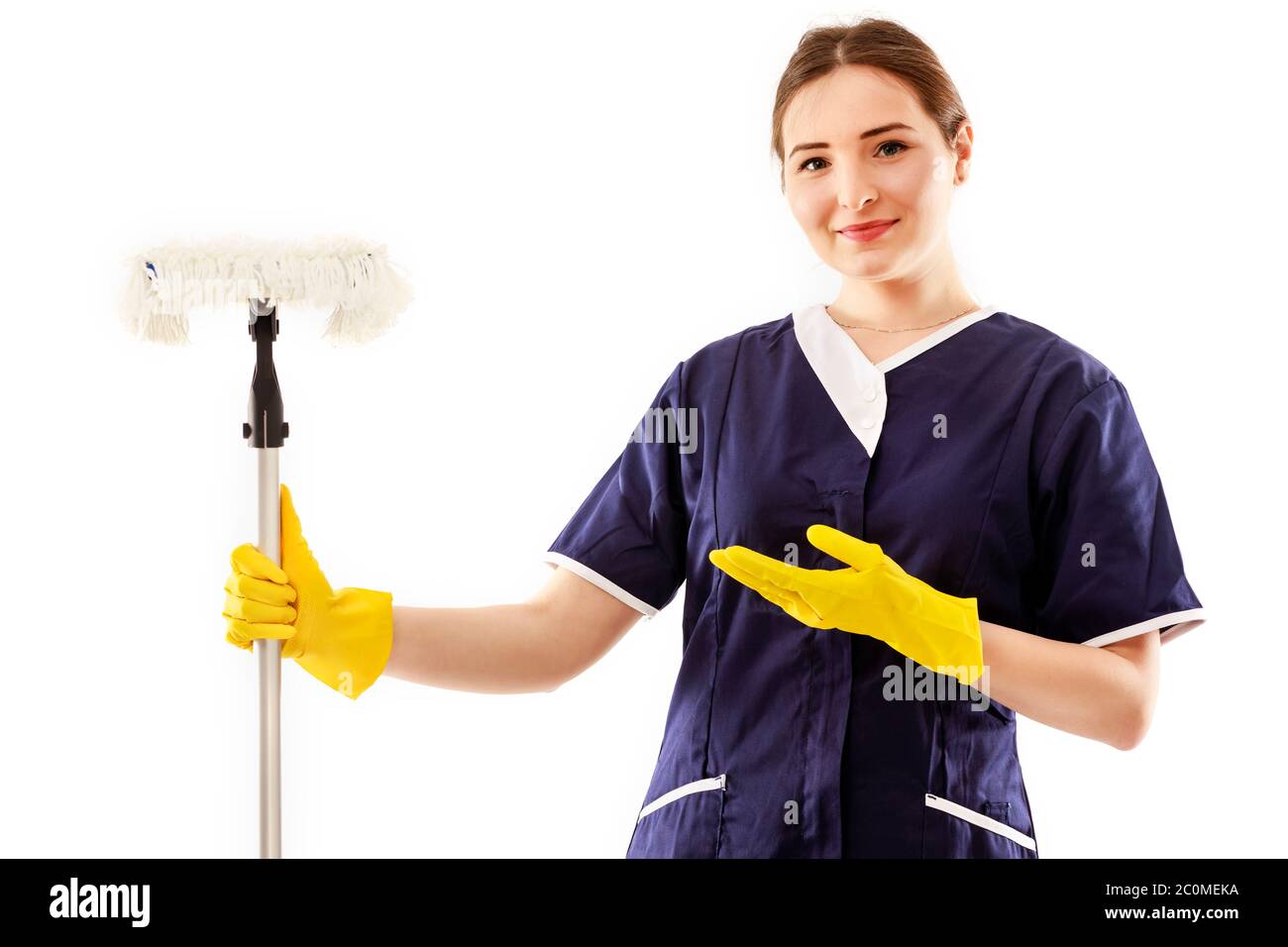 Cleaning woman pointing and showing your product or text isolated on ...