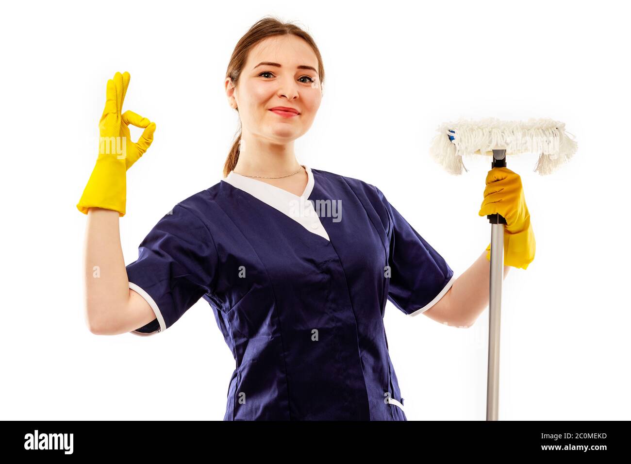 Woman finished cleaning showing a happy thumbs up after a successful ...
