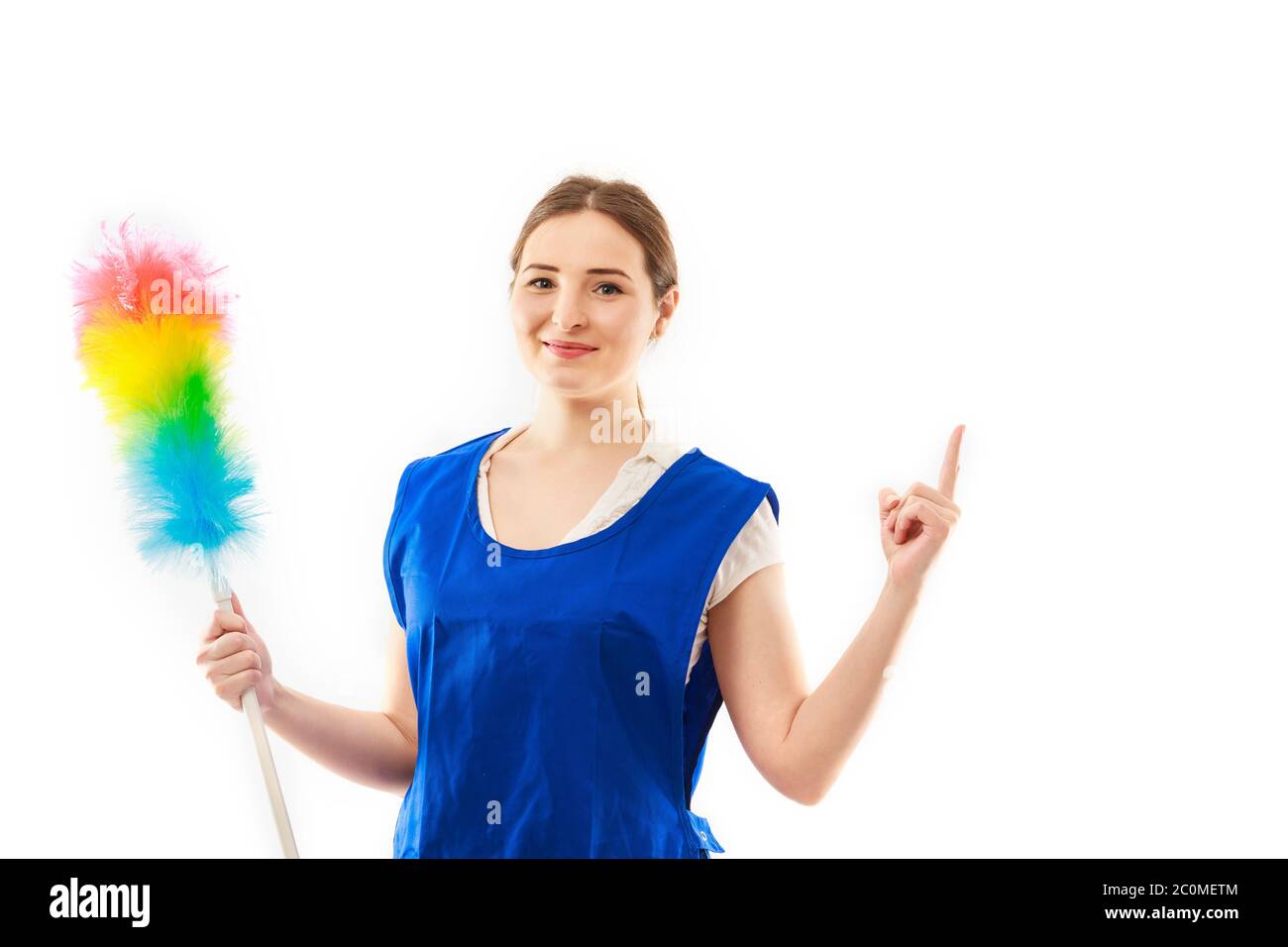 Cleaning woman pointing and showing your product or text isolated on ...