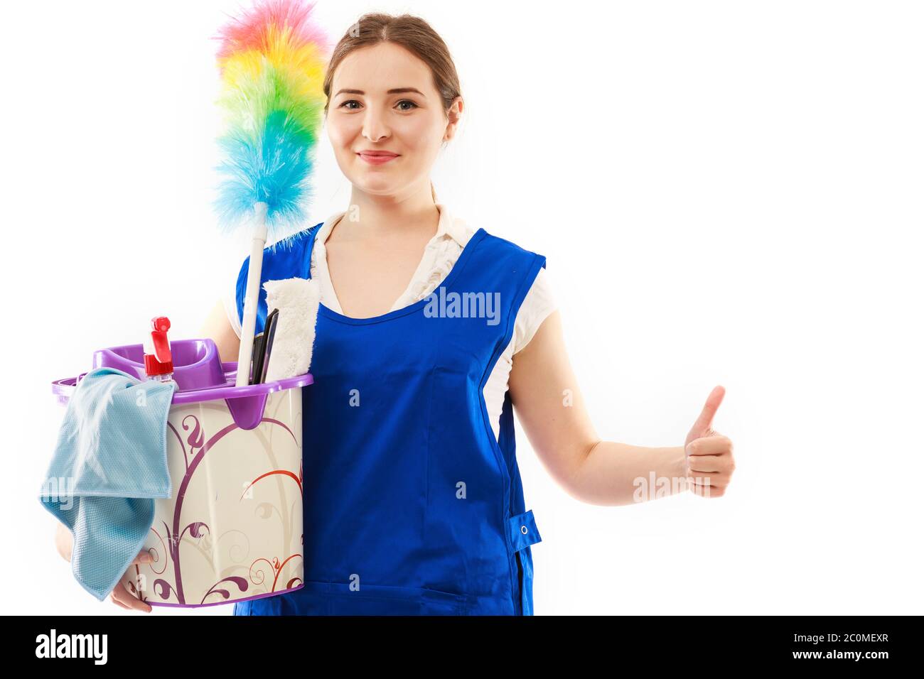 Woman finished cleaning showing a happy thumbs up after a successful ...