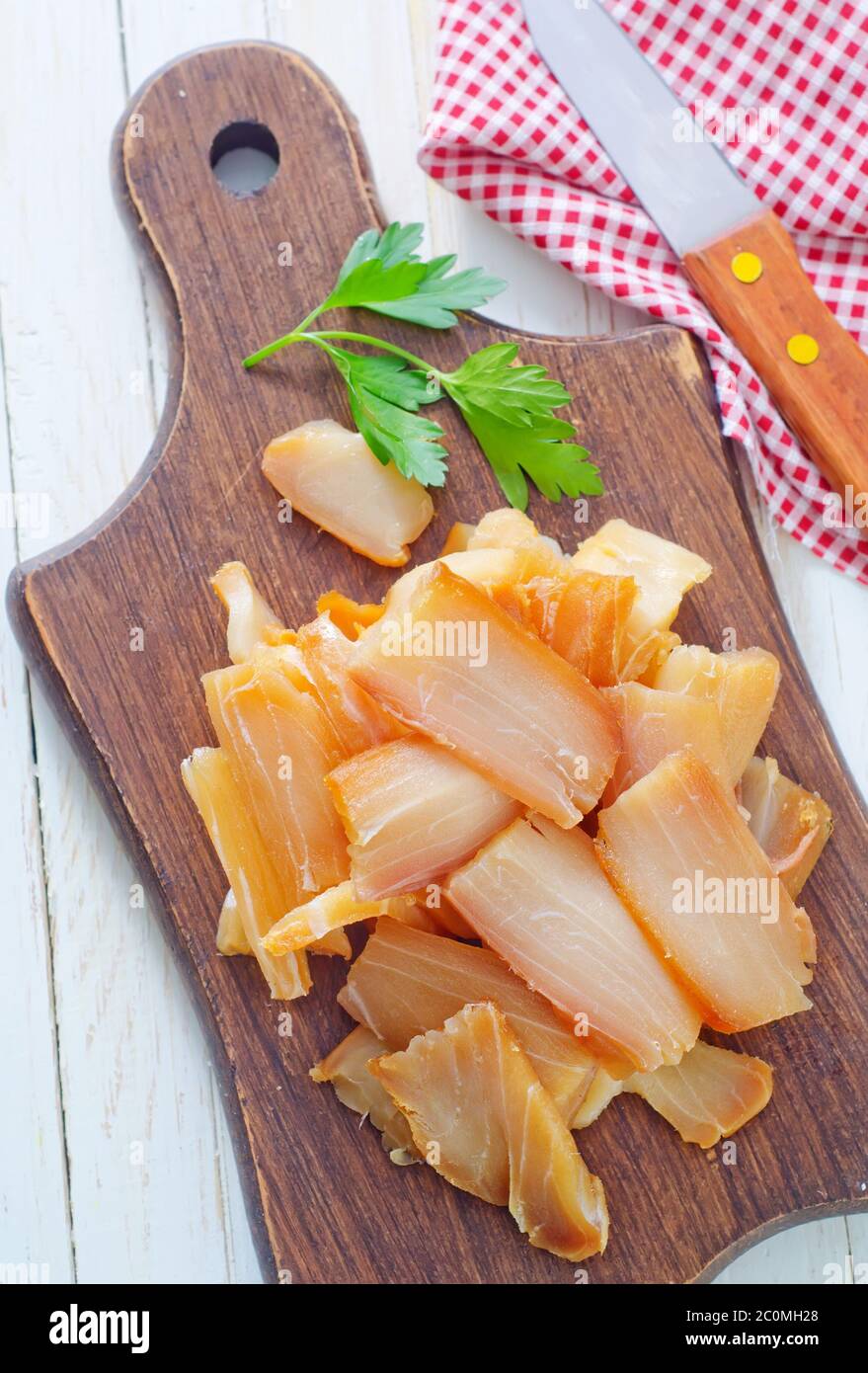 smoked fish on board Stock Photo - Alamy