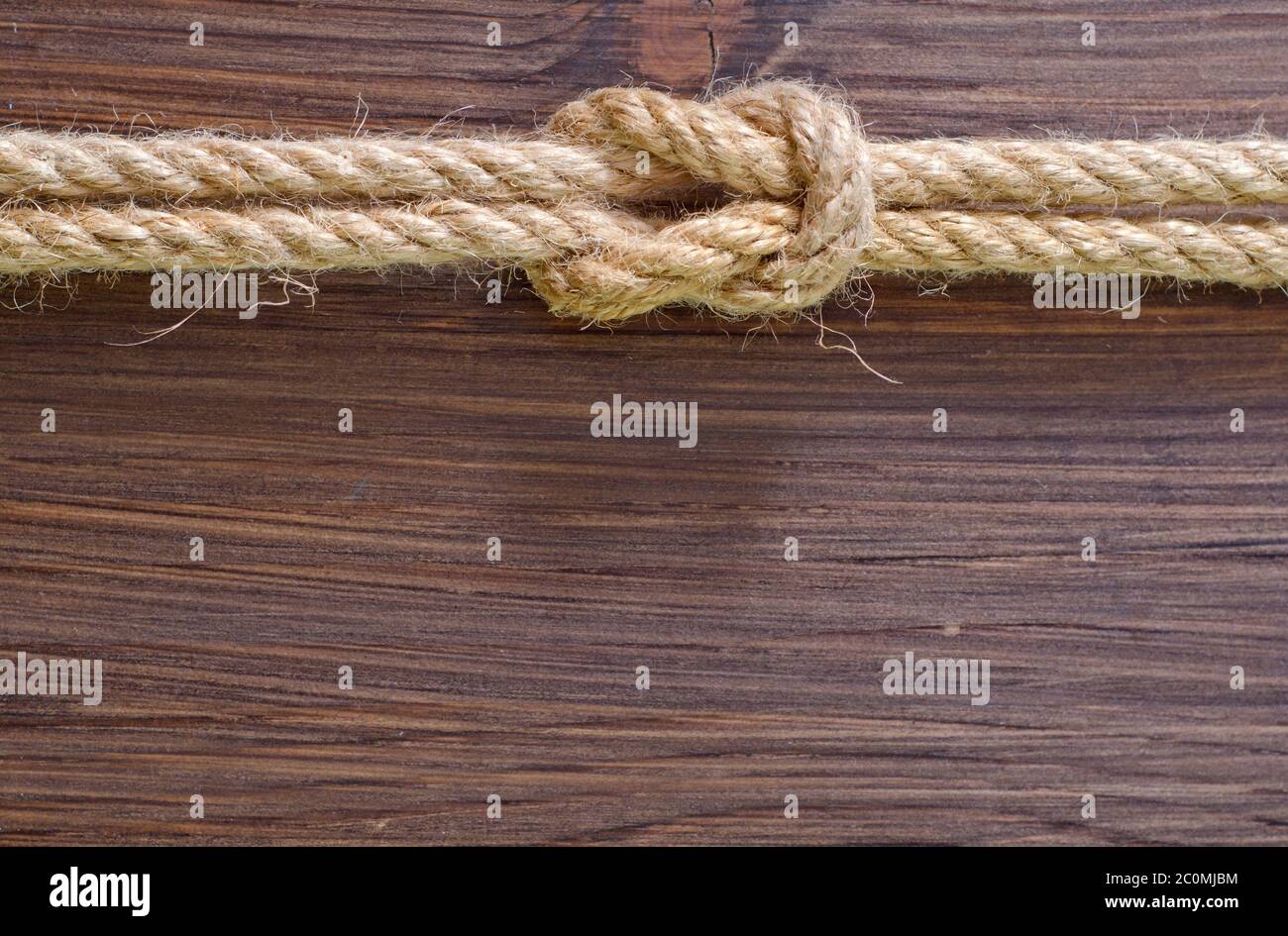 rope on wooden backgrounds Stock Photo - Alamy
