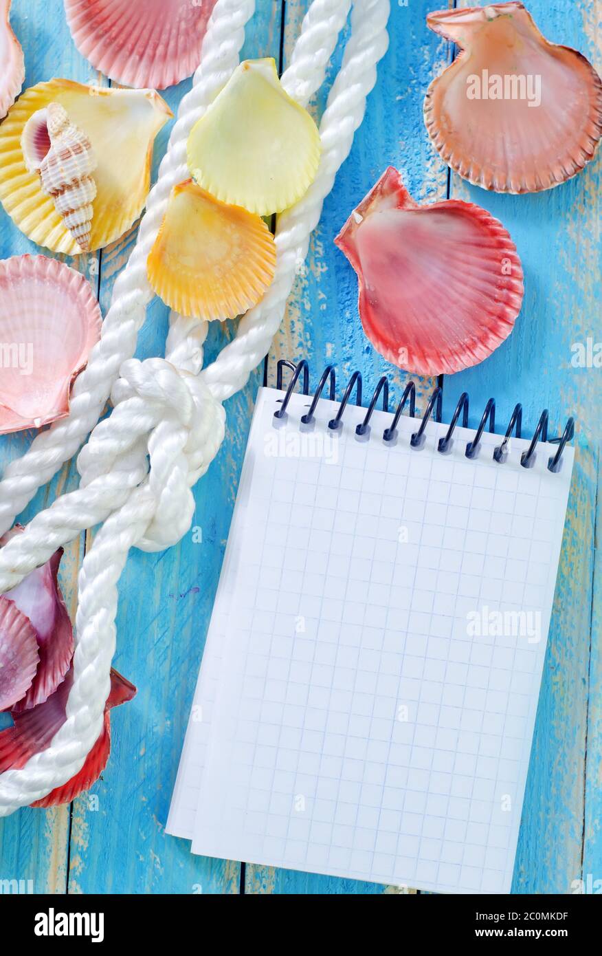 note and sea shell Stock Photo - Alamy
