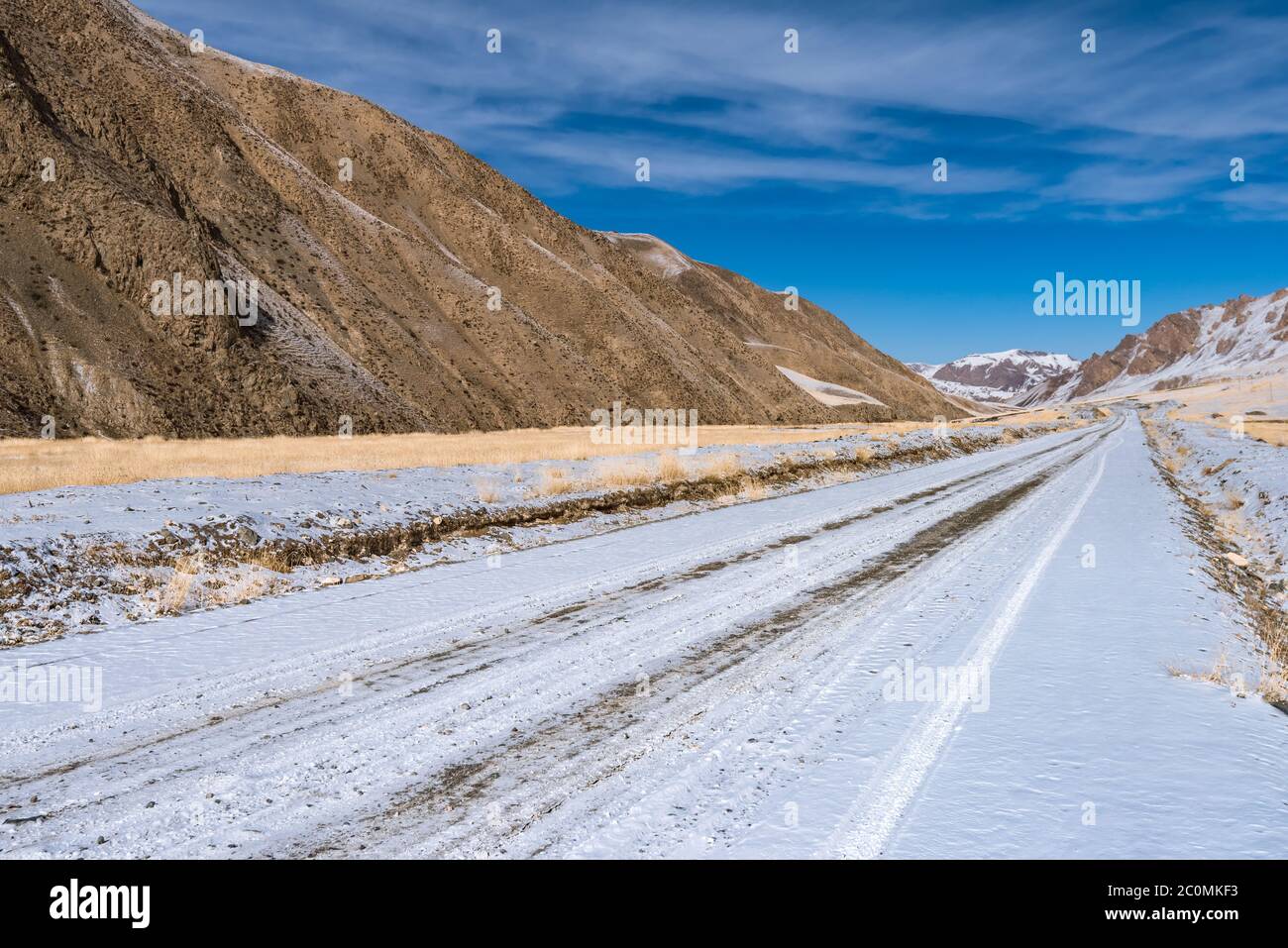 the gravel road on the snow mountain Stock Photo - Alamy