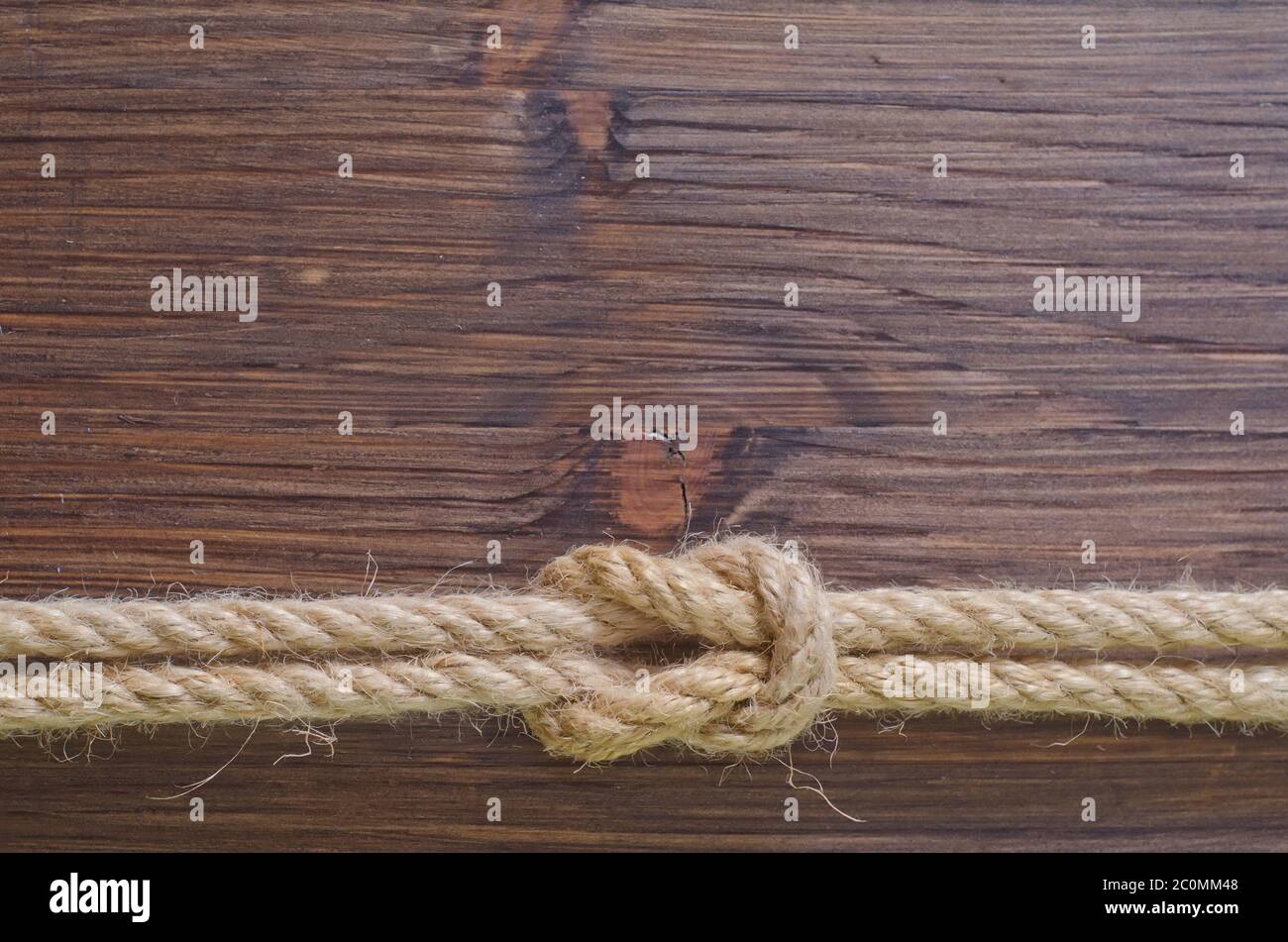 rope on wooden backgrounds Stock Photo - Alamy