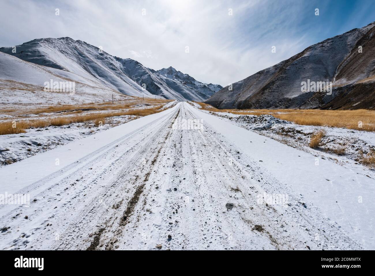 the gravel road on the snow mountain Stock Photo - Alamy