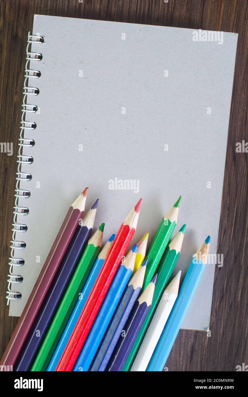 color pencils and note Stock Photo - Alamy