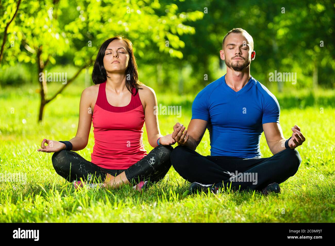 Couple doing yoga together in hi-res stock photography and images - Alamy