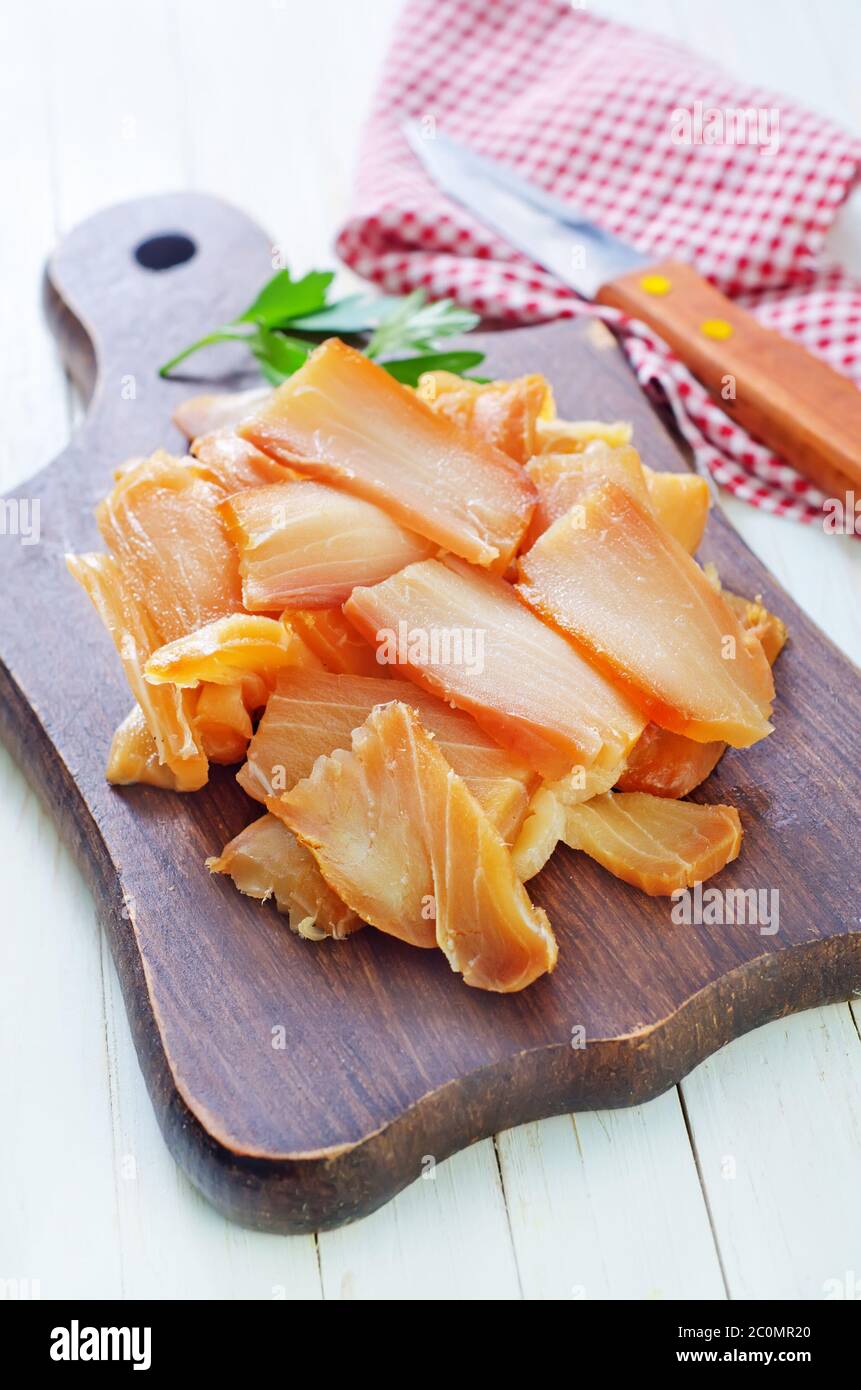 smoked fish on board Stock Photo - Alamy