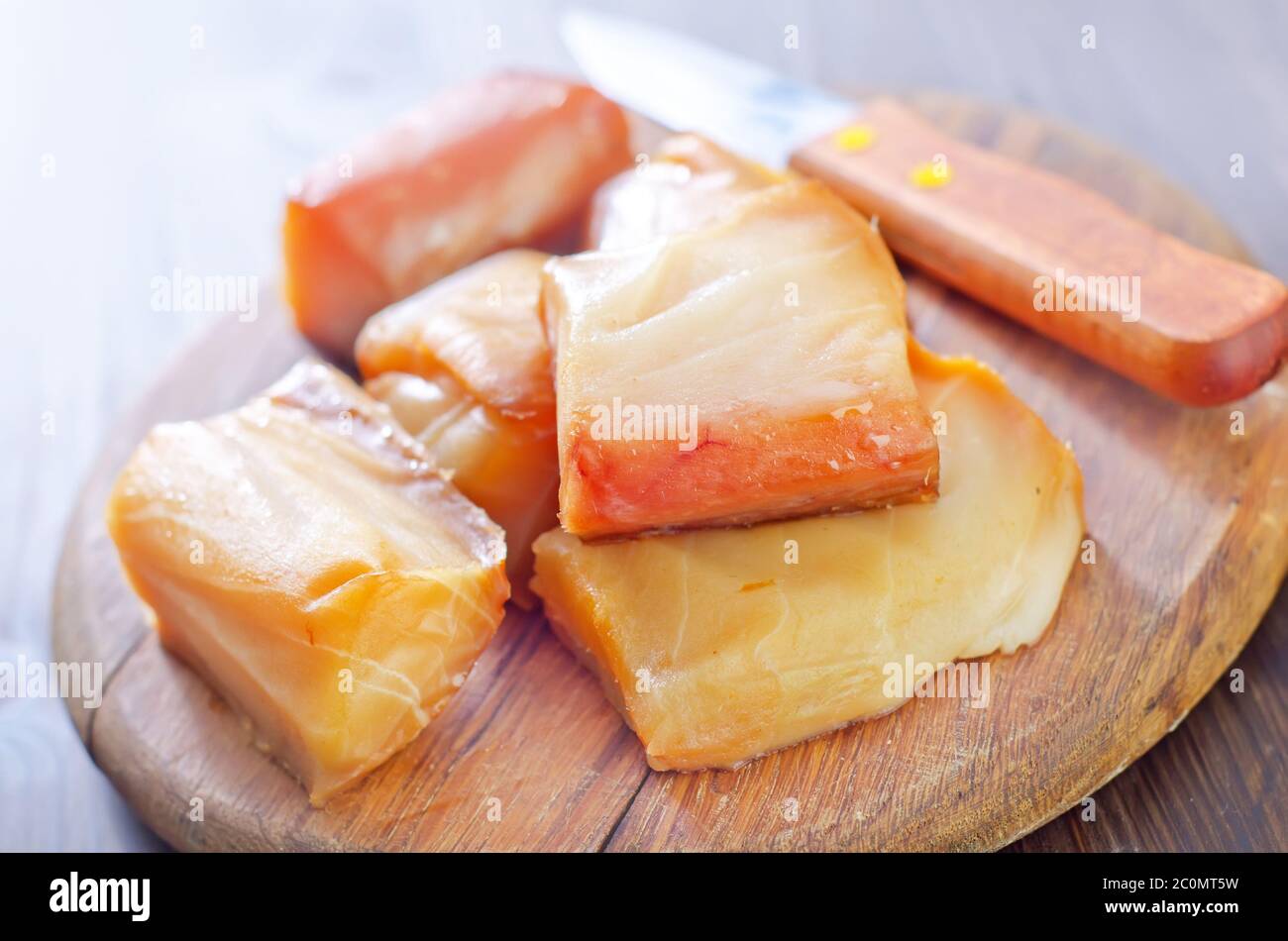 smoked fish on board Stock Photo - Alamy
