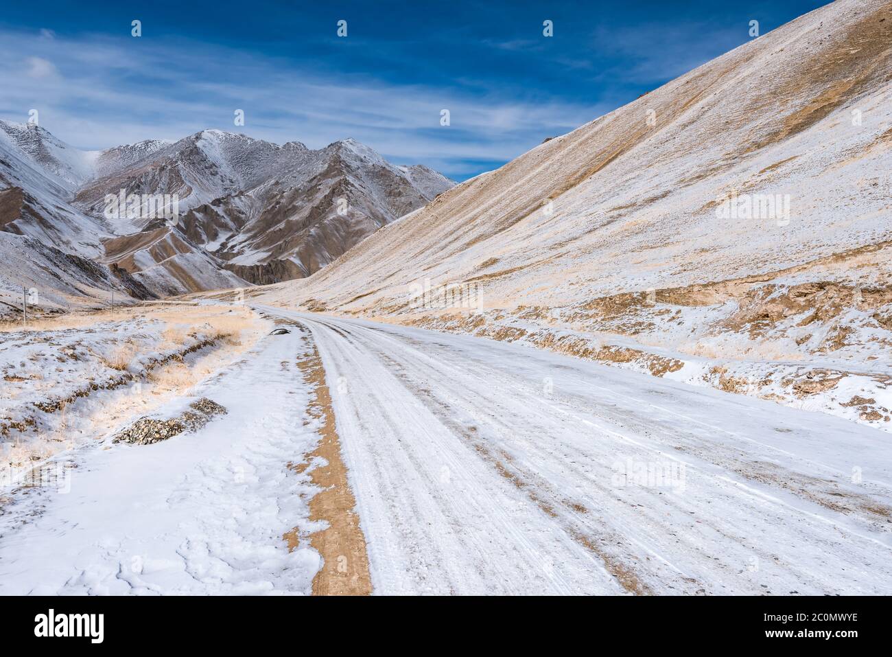 the gravel road on the snow mountain Stock Photo - Alamy