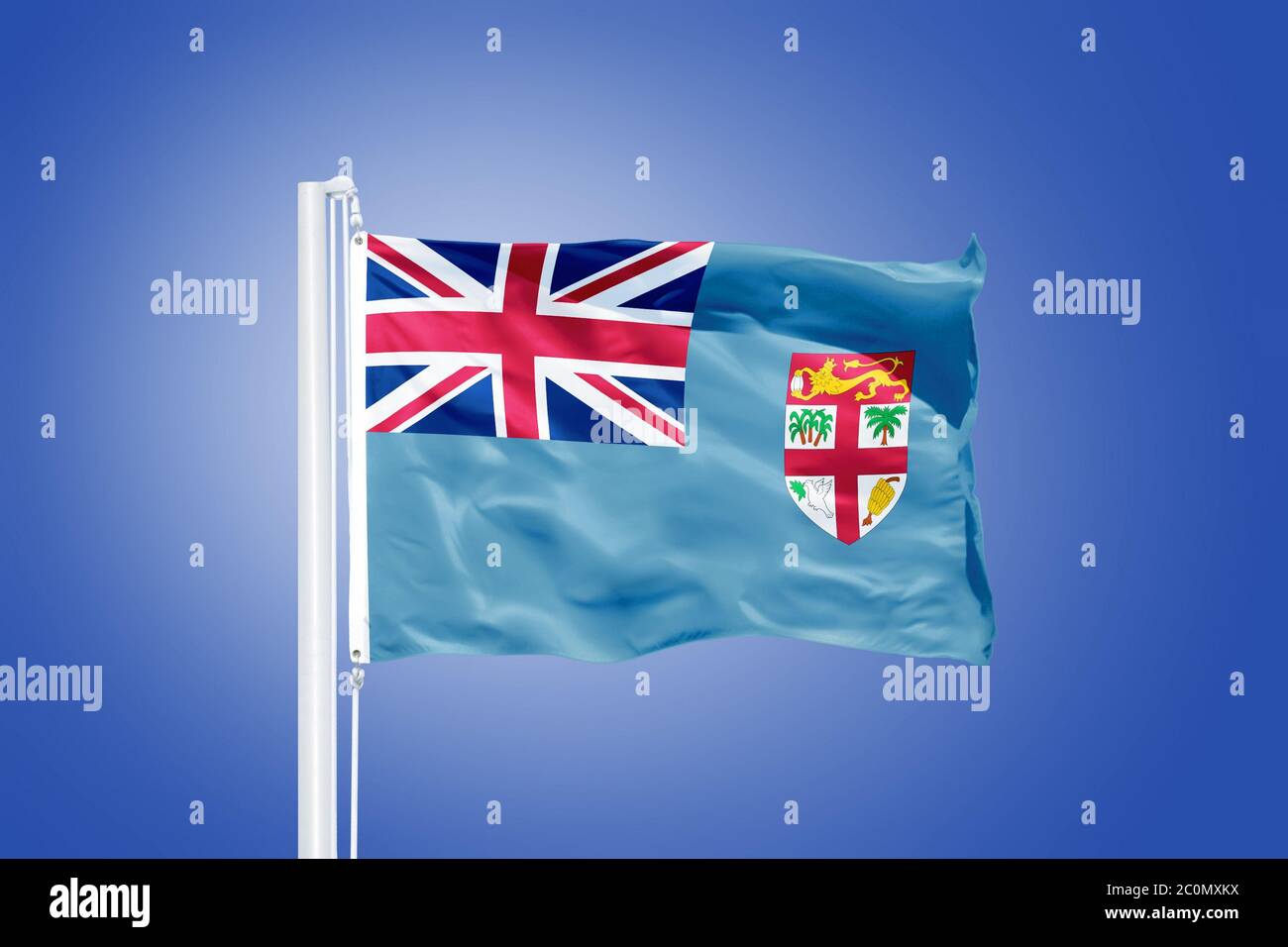 Flag of Fiji flying against a blue sky Stock Photo - Alamy