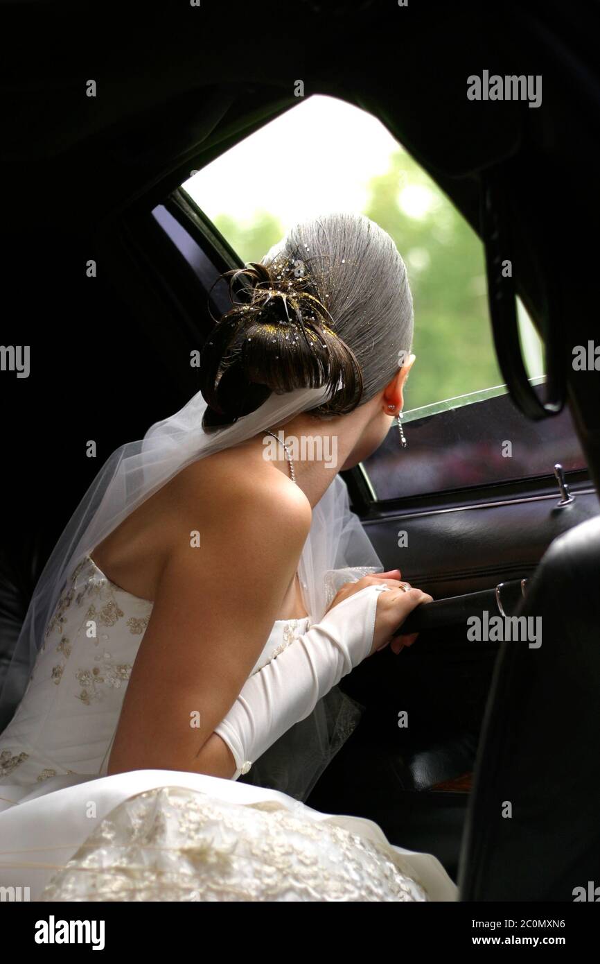 Bride in car Stock Photo - Alamy