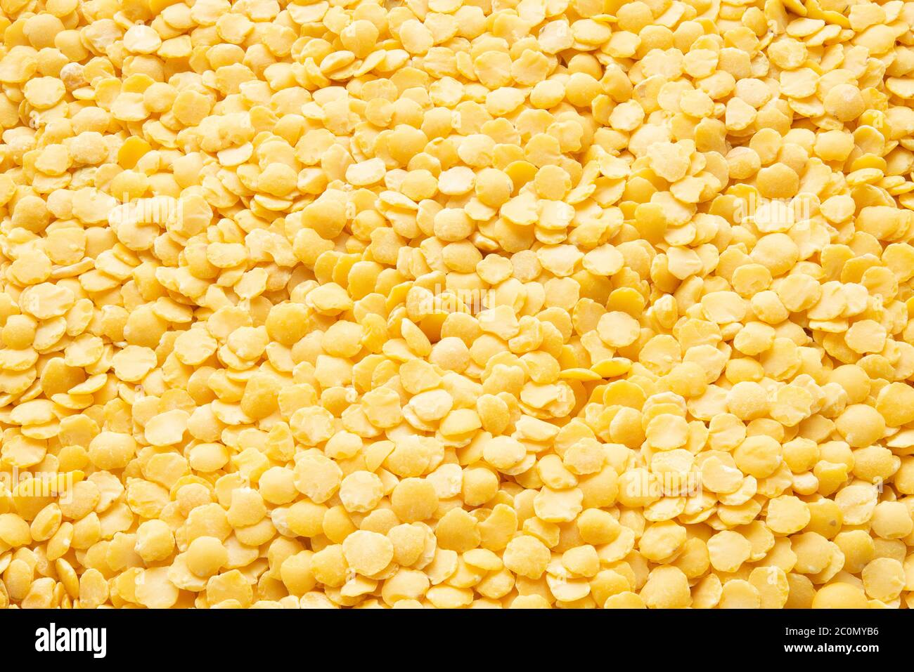 Yellow lentils background. Focus all over the frame Stock Photo - Alamy