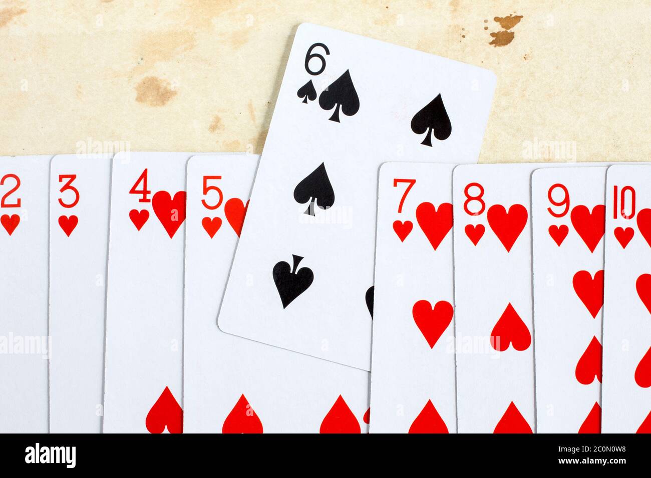 Red hearts and one black spade Stock Photo - Alamy