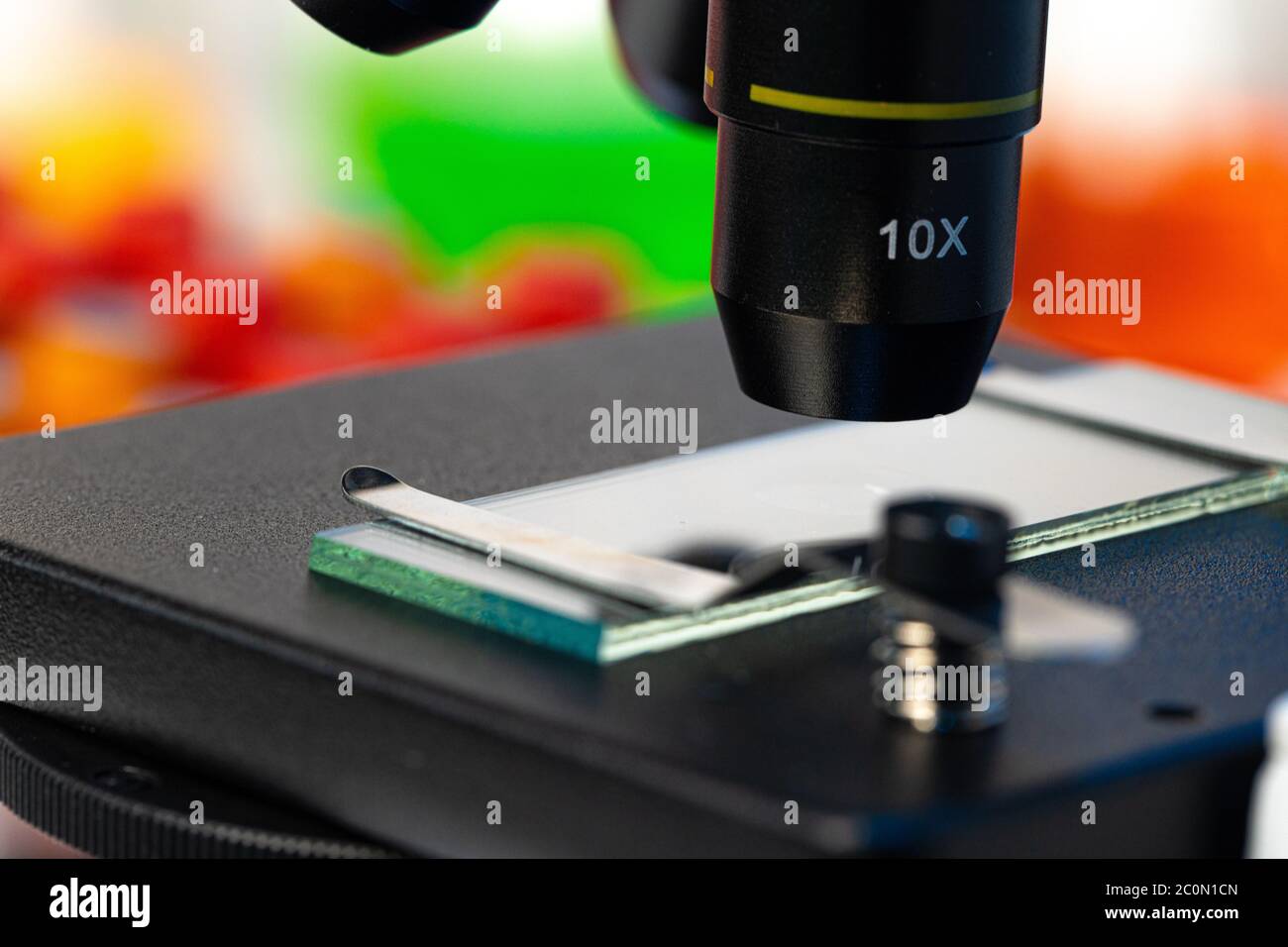 Close up photo of a microscope lenses examining glass sample Stock ...