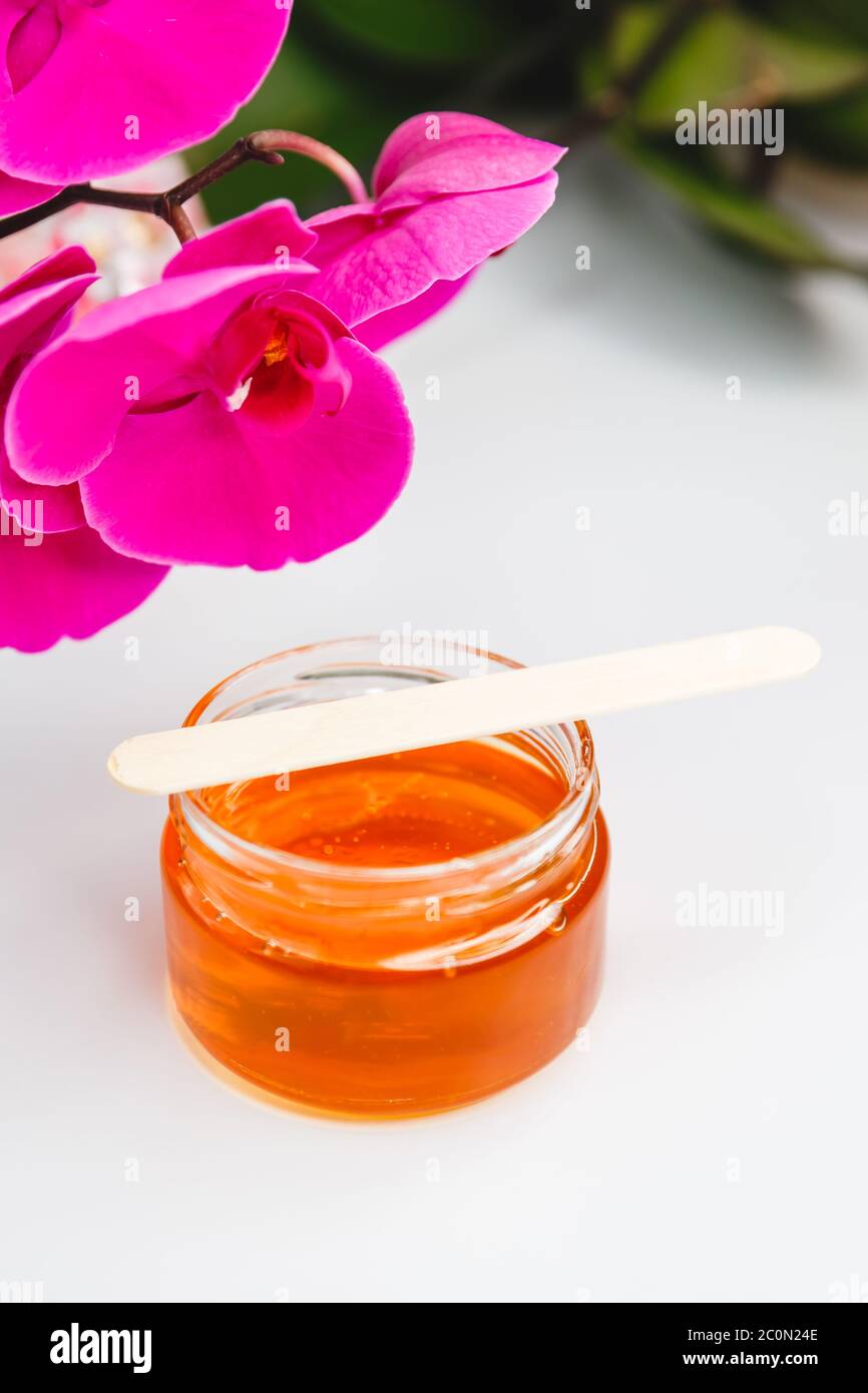 Shugaring paste in a jar with a spatula. Sugar paste for hair removal ...