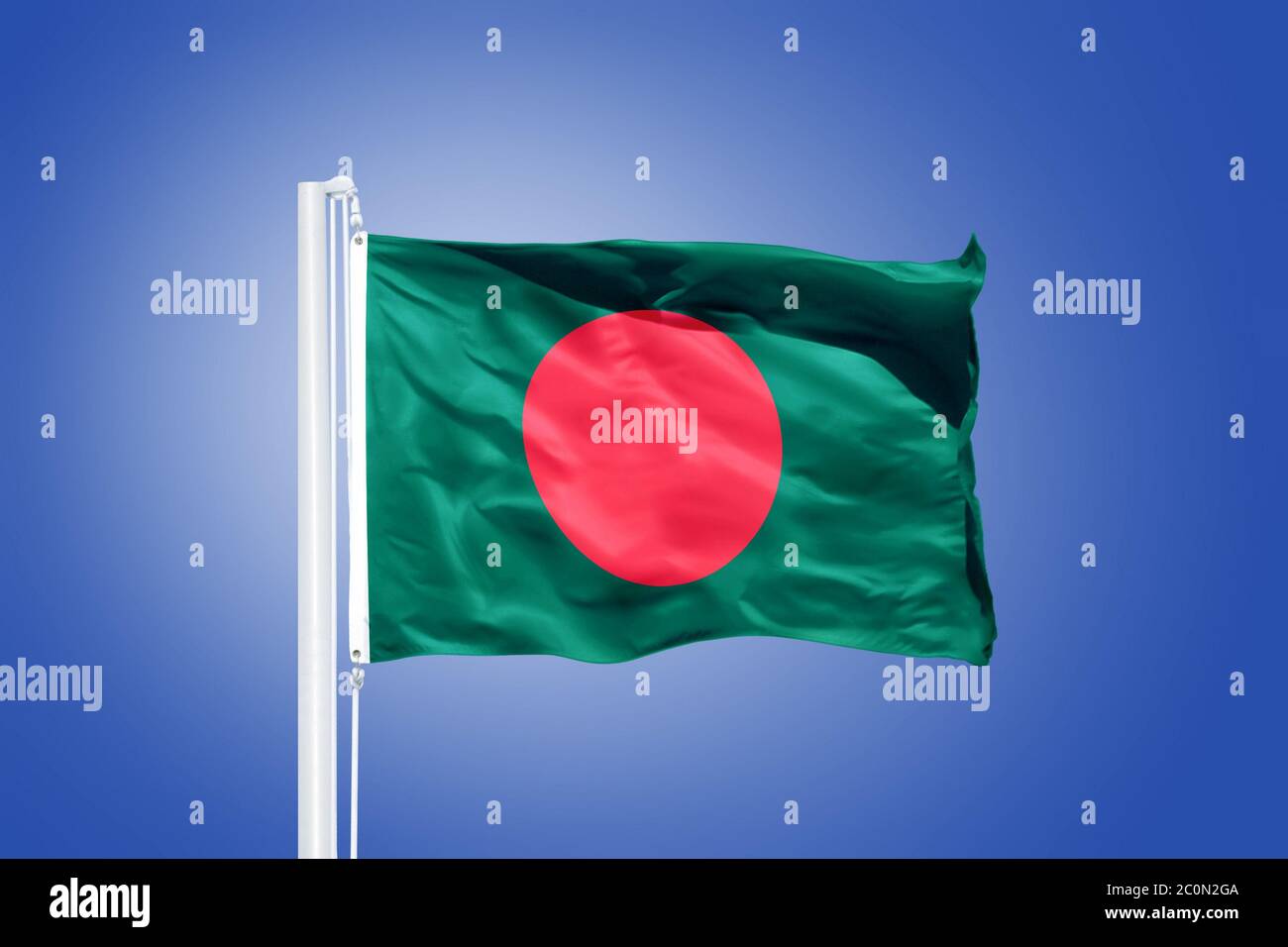 Flag of Bangladesh flying against a blue sky Stock Photo - Alamy