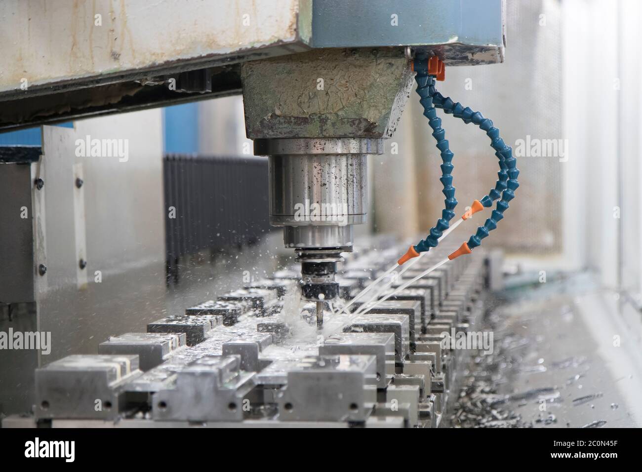 Close up on an industrial drill inside a production line, tools are ...