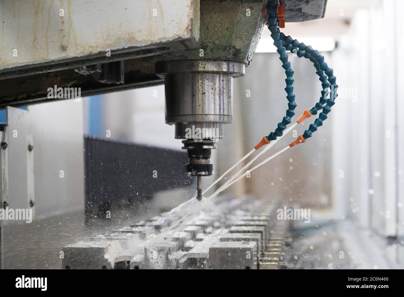 Close up on an industrial drill inside a production line, tools are ...