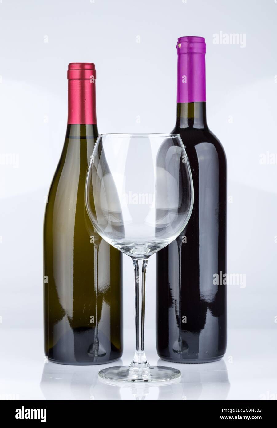 Three wine bottles isolated on white background Stock Photo - Alamy
