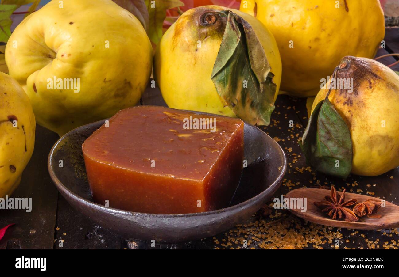 Homemade quince candy and raw fruits Stock Photo - Alamy