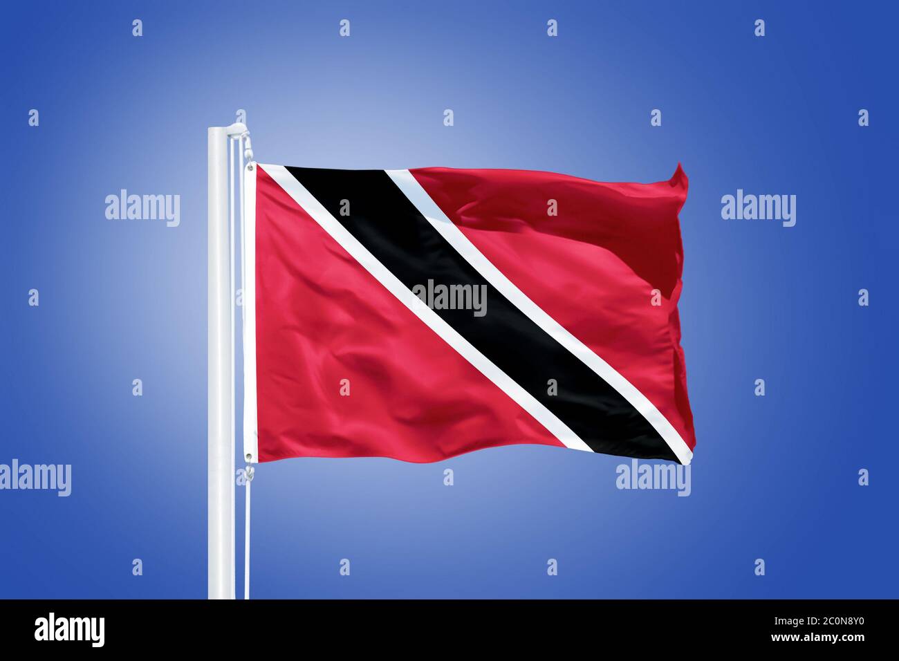 Flag of Trinidad and Tobago flying against a blue sky Stock Photo - Alamy
