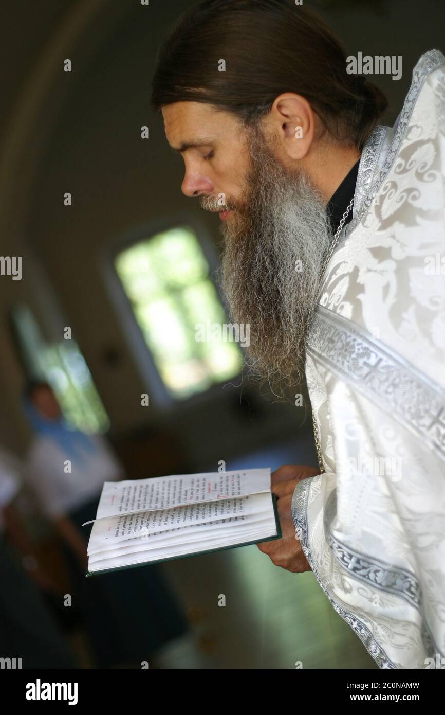 Priest with Bible Stock Photo - Alamy
