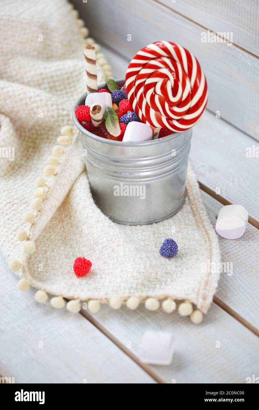 Colorful candies in a small bucket Stock Photo - Alamy