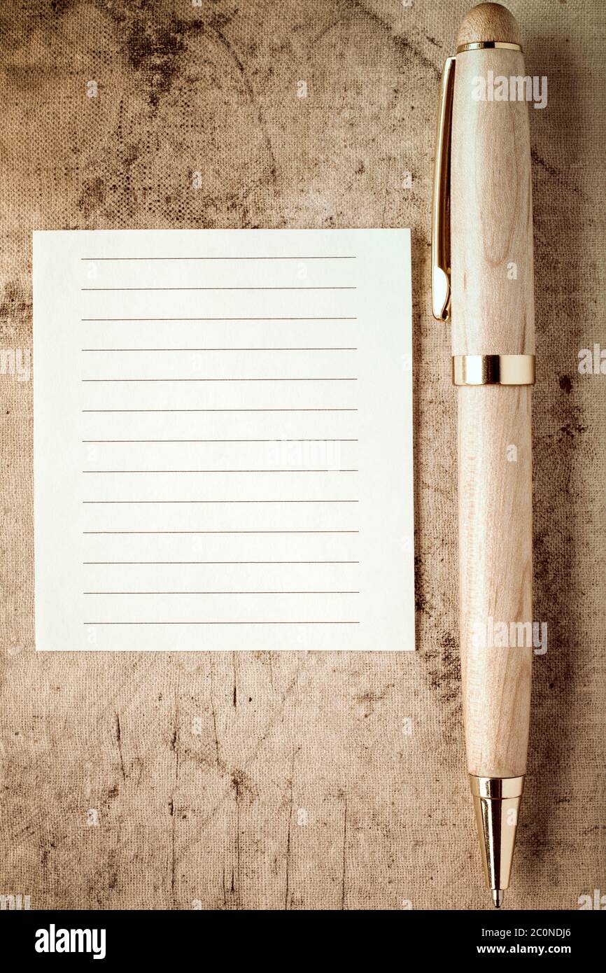 Wooden pen and empty paper note for your text Stock Photo - Alamy