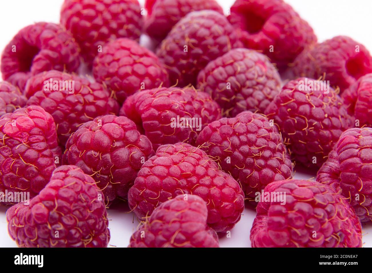 Raspberries isolated on white background Stock Photo - Alamy