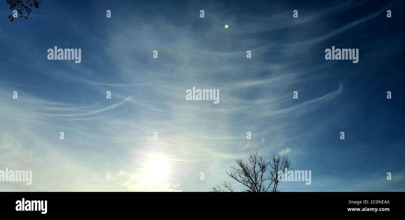 Blue sky with sun rising Stock Photo - Alamy