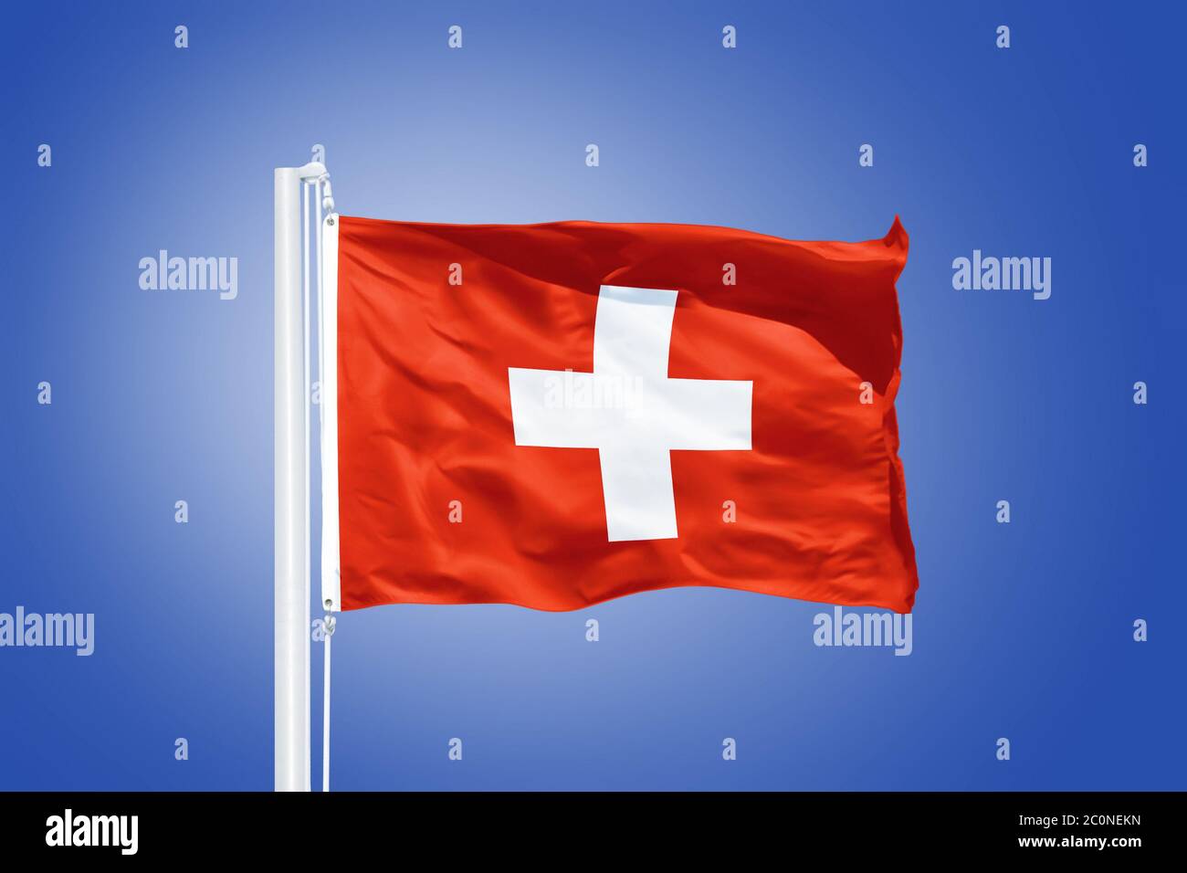 Flag of Switzerland flying against a blue sky Stock Photo - Alamy