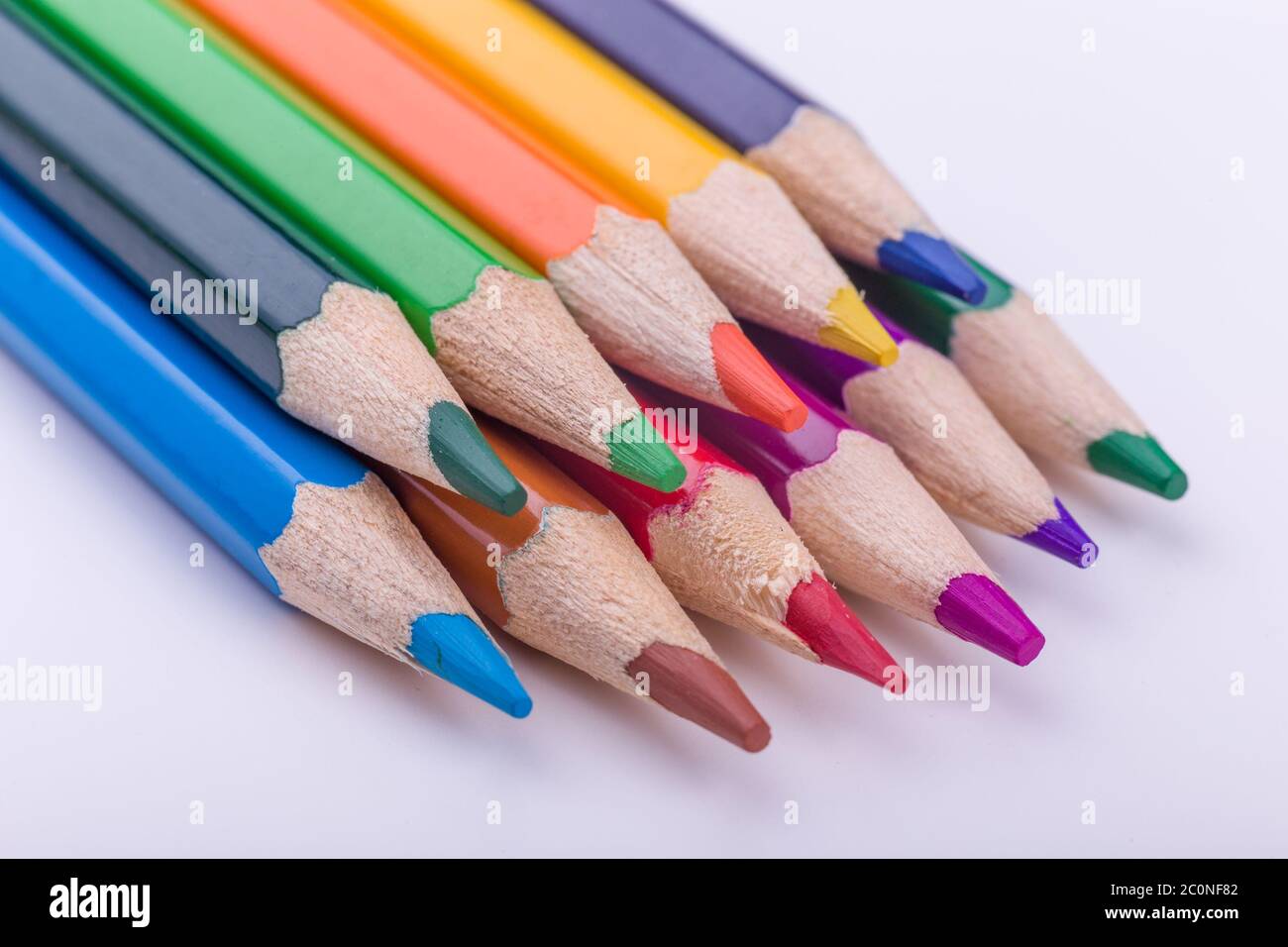 Many different colored pencils on white background Stock Photo - Alamy