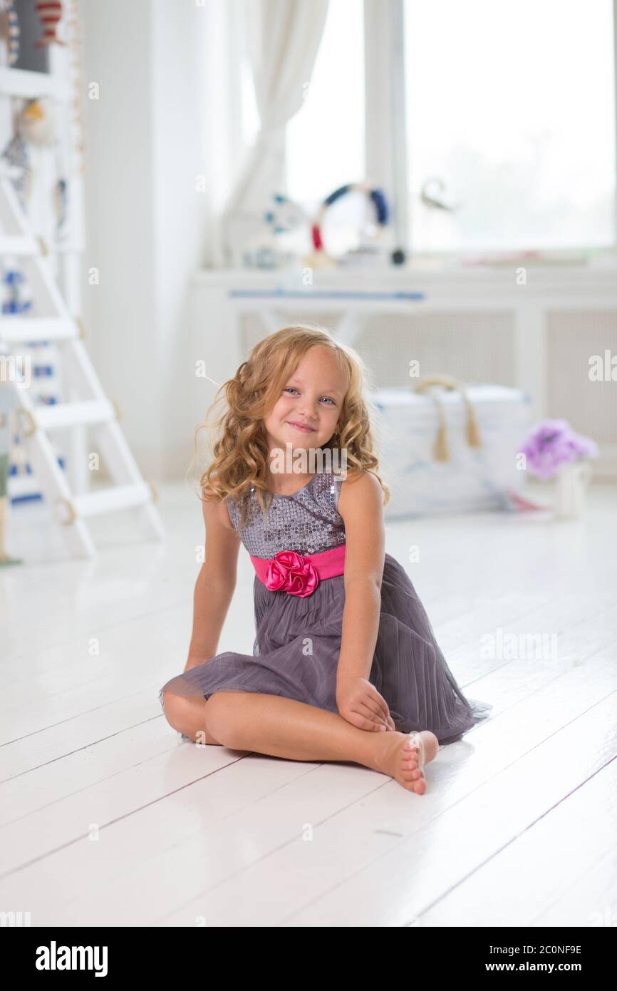 Female child sitting in her room Stock Photo - Alamy