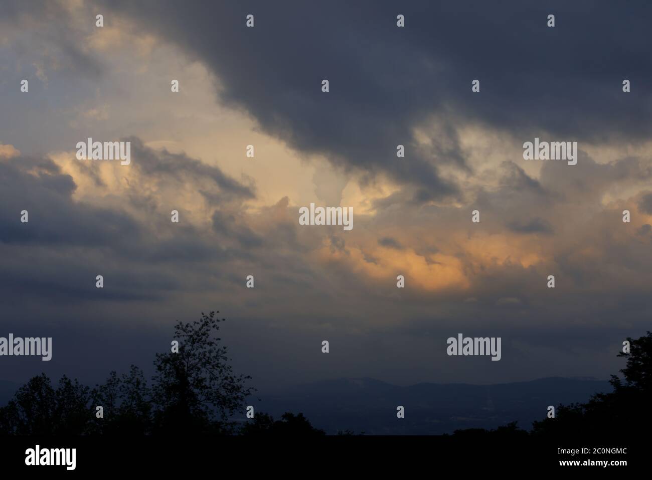 a summer thunderstorm in the Blue Ridge Mountains of Virginia depicting ...