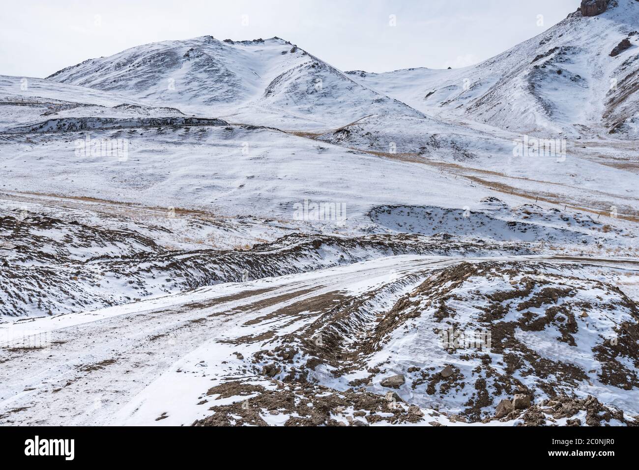 the gravel road on the snow mountain Stock Photo - Alamy