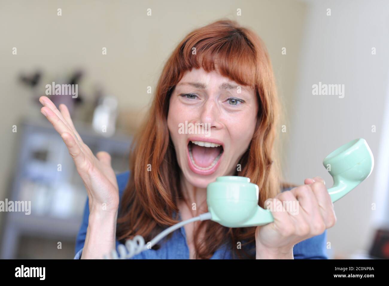 woman shouting at the phone Stock Photo - Alamy