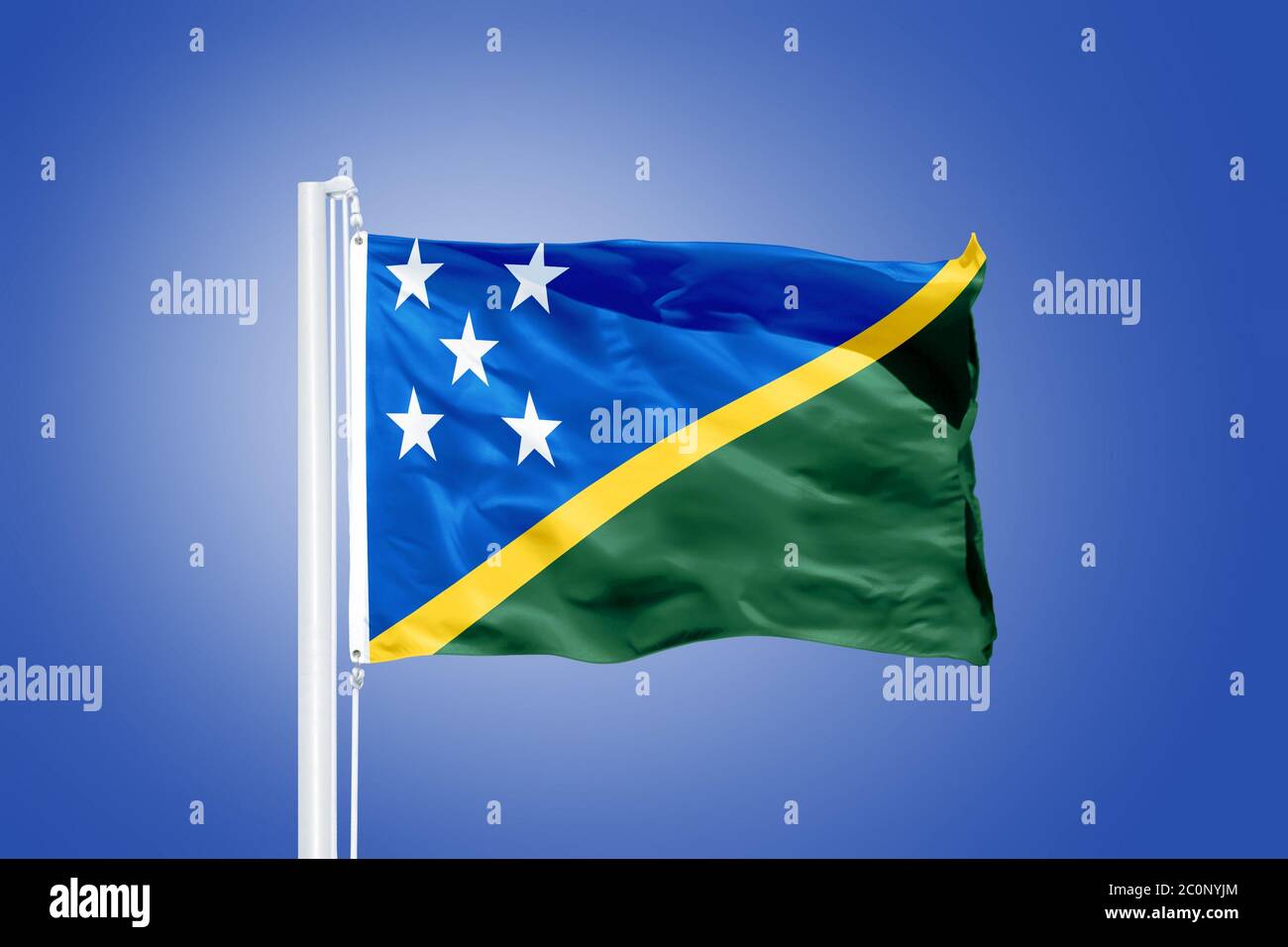 Flag of Solomon Islands flying against a blue sky Stock Photo - Alamy