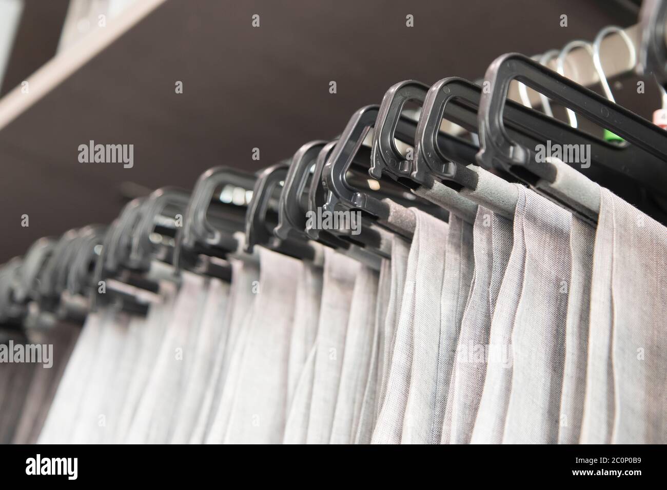 Close up on hanging pants on a rack, for a retail concept image Stock ...