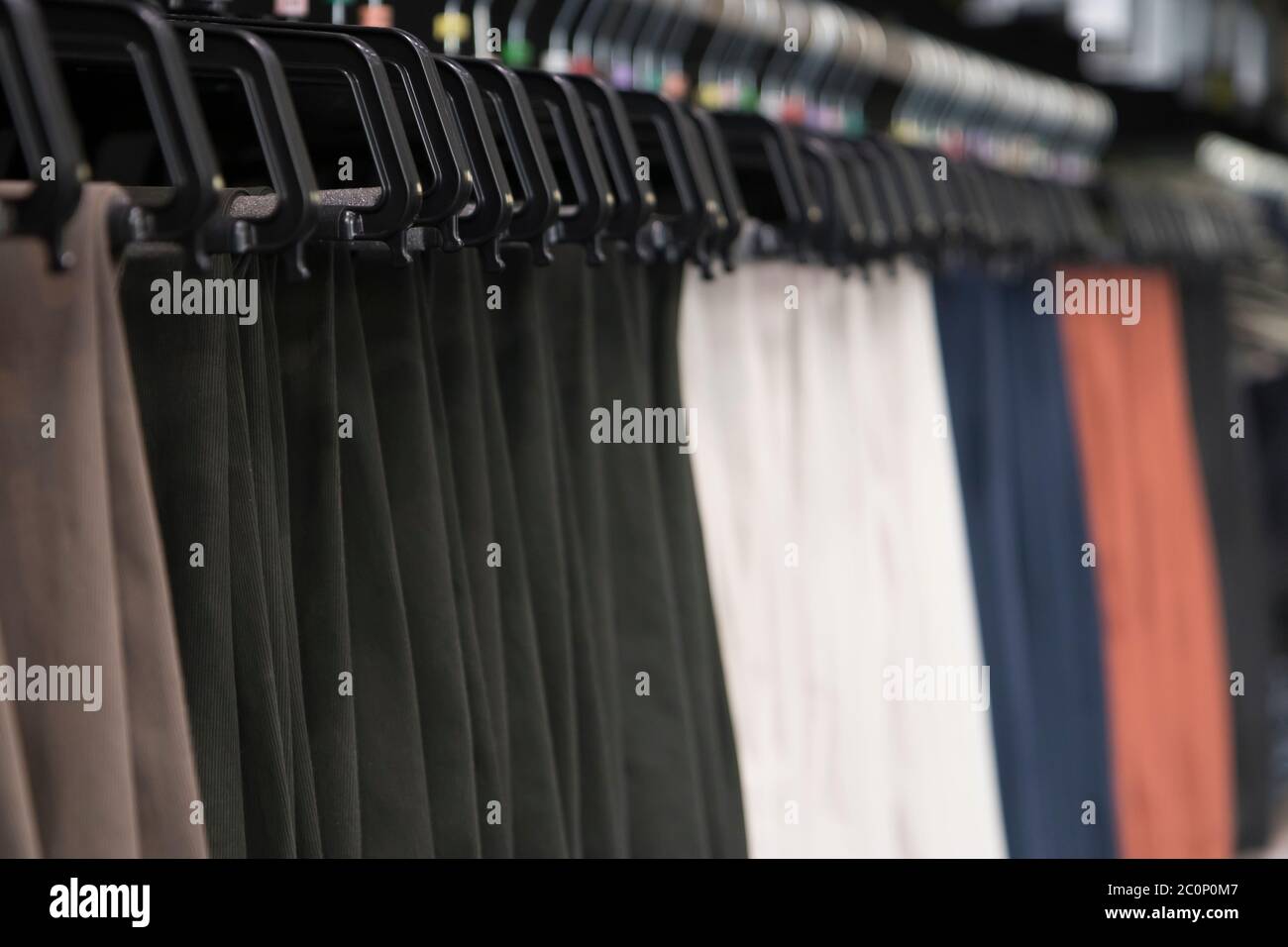 Close up on hanging pants on a rack, for a retail concept image Stock ...