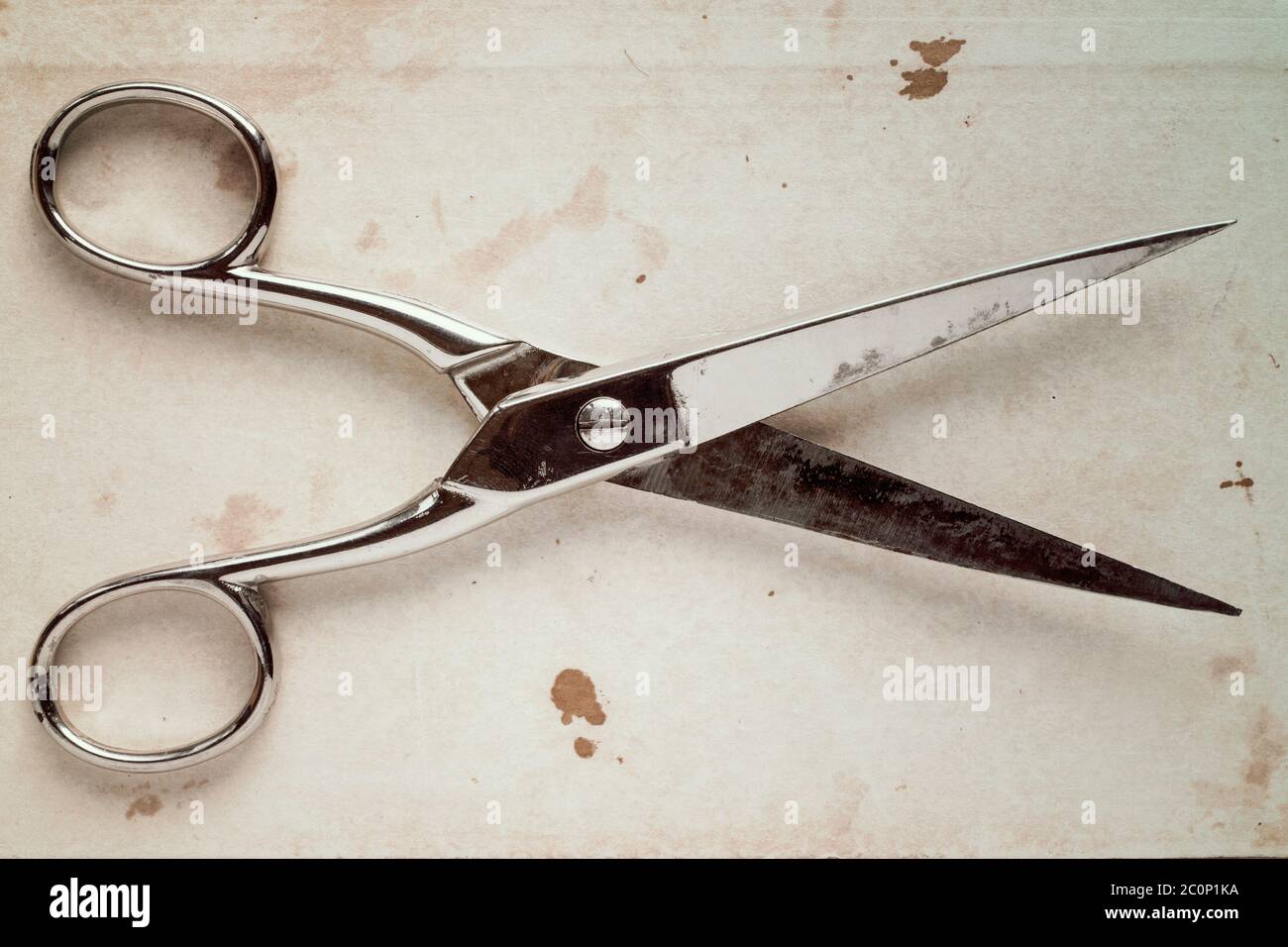 Old scissors on a paper background Stock Photo - Alamy