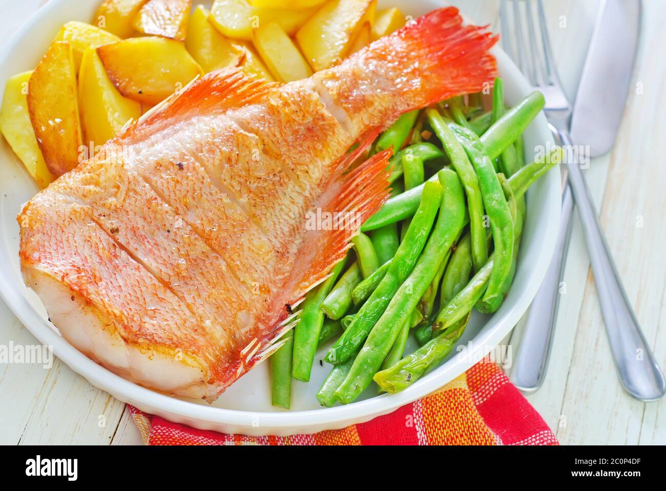 fried fish, potato and green beans Stock Photo - Alamy