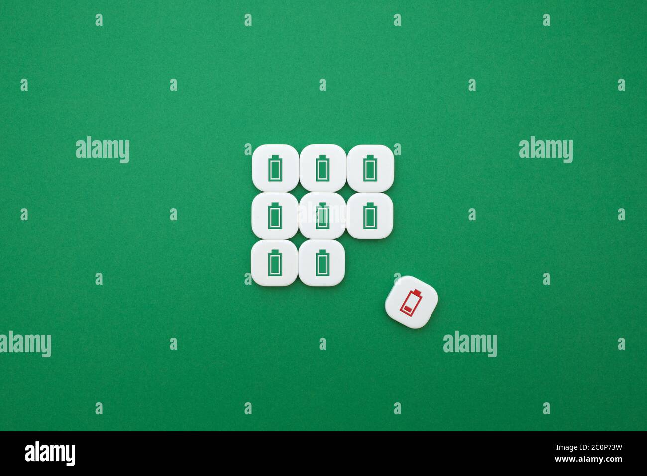 a discharged battery icon between several fully charged battery icons ...