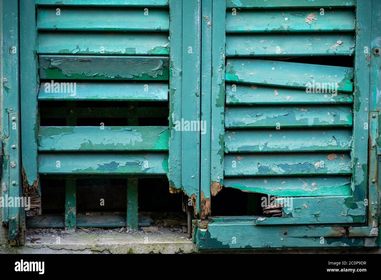Old broken green shutter window in the medieval village of Ripafratta ...