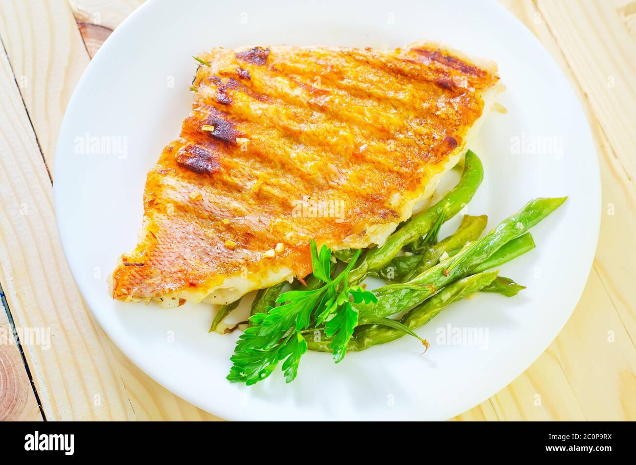 fried fish with green beans Stock Photo - Alamy