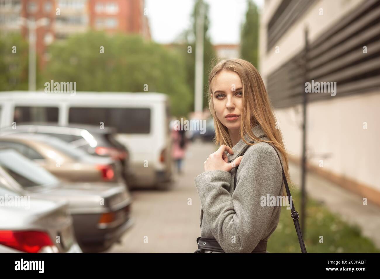 sad serious young woman at parking looking back at camera Stock Photo ...