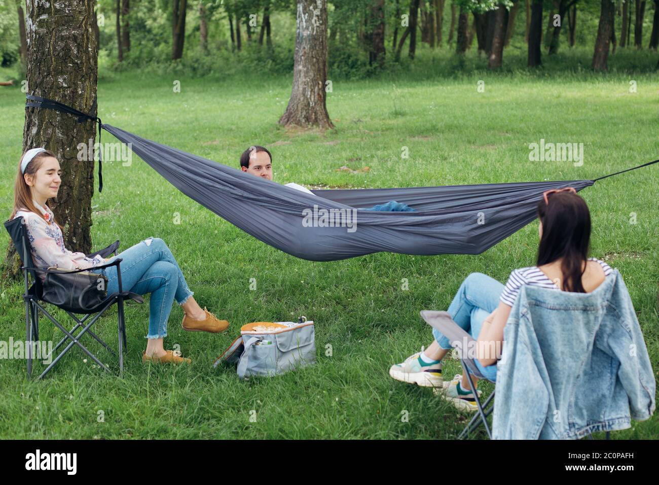 Social distancing. Small group of people enjoying conversation at ...