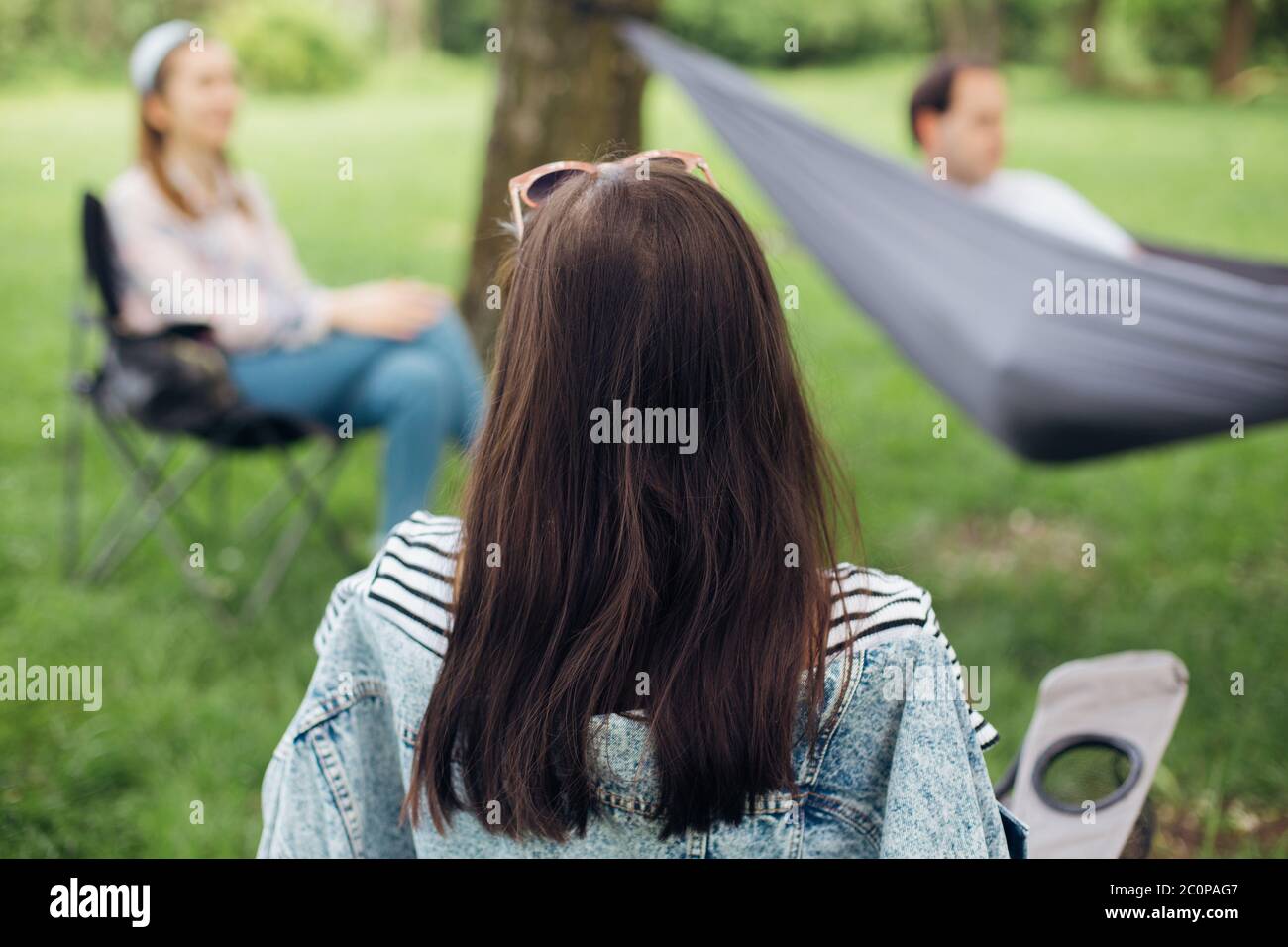 Social distancing. Small group of people enjoying conversation at ...